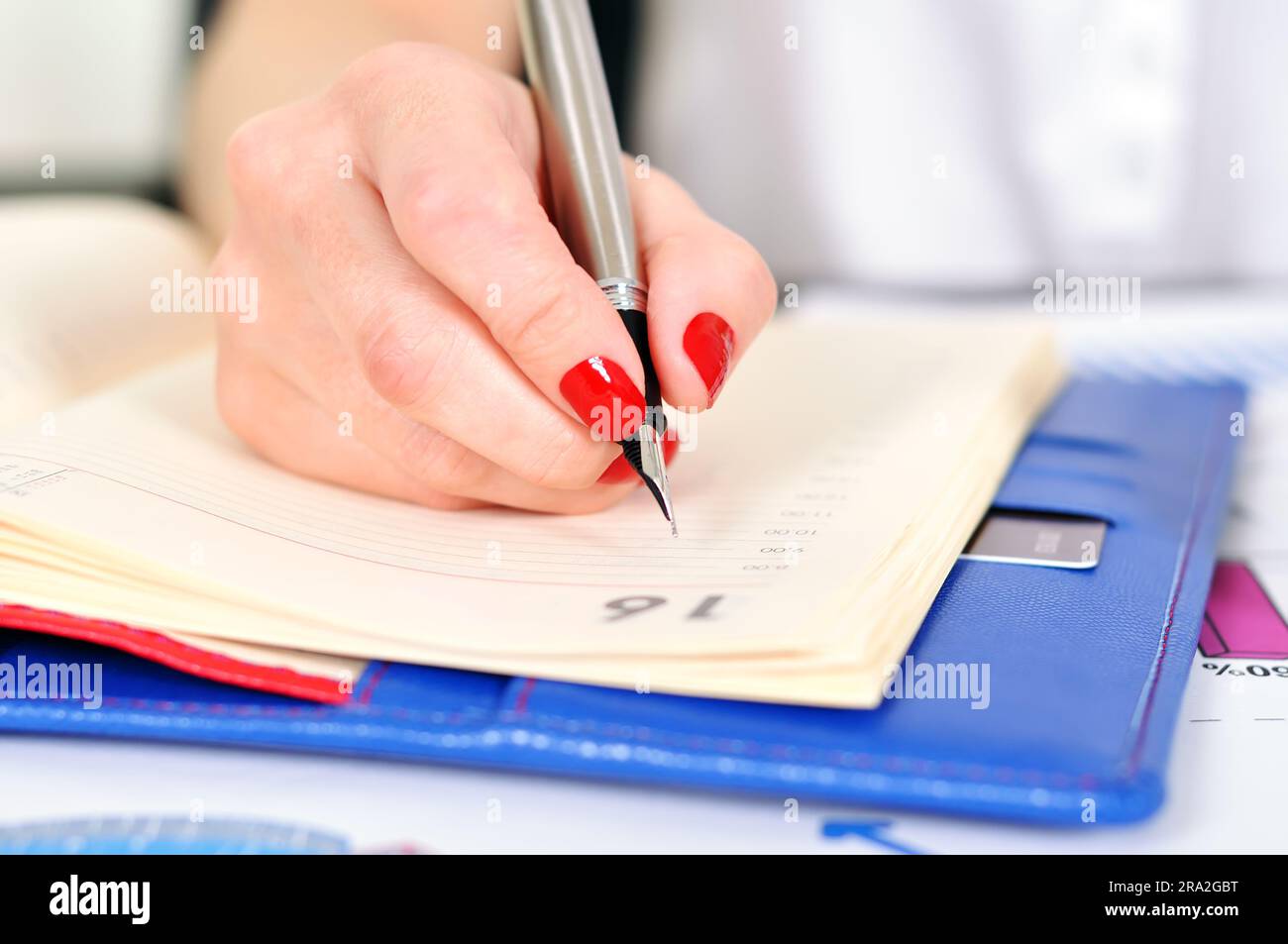fountain pen writing on a blank notebook Stock Photo - Alamy