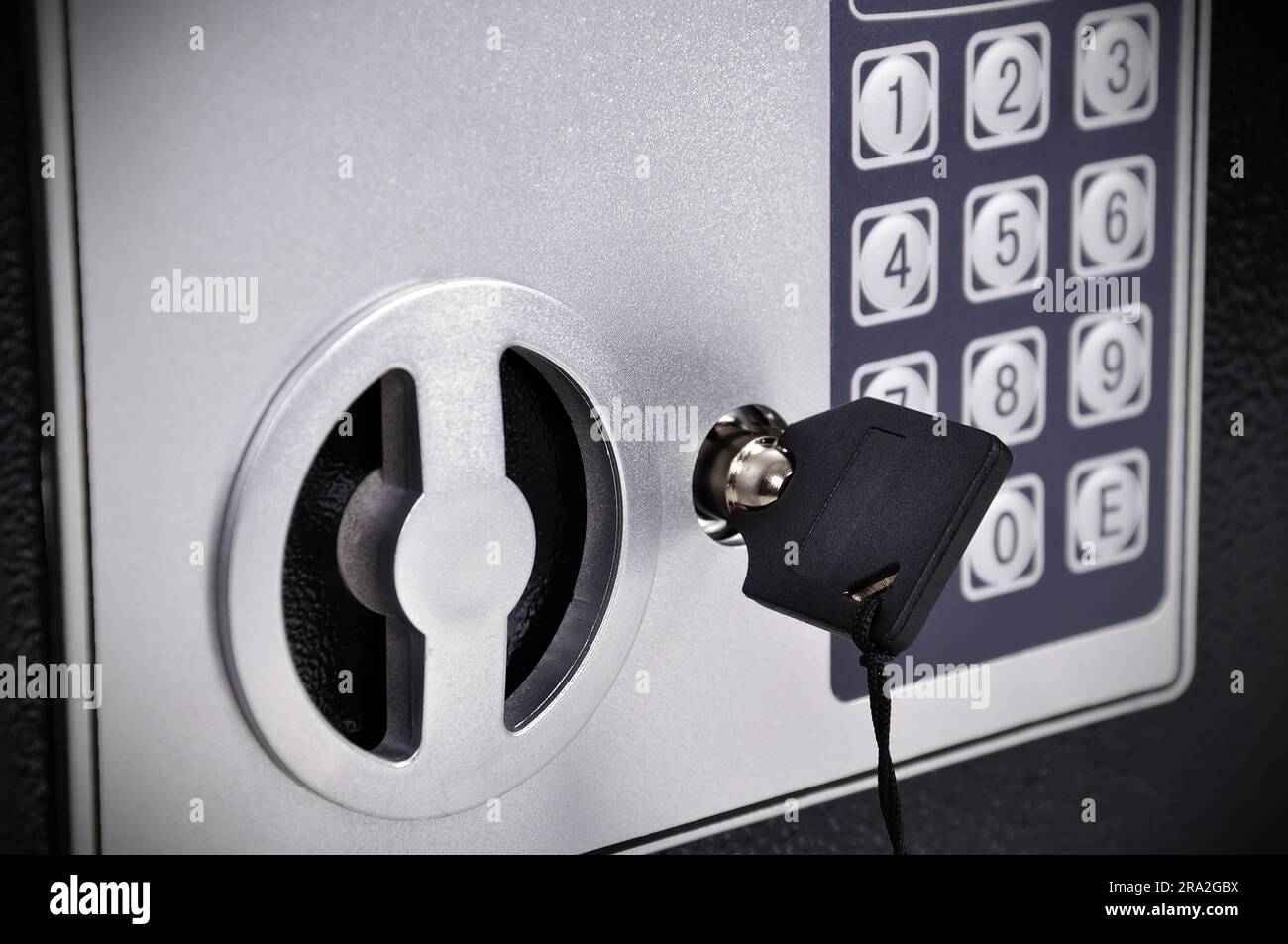 key is inserted in lock of safe Stock Photo - Alamy