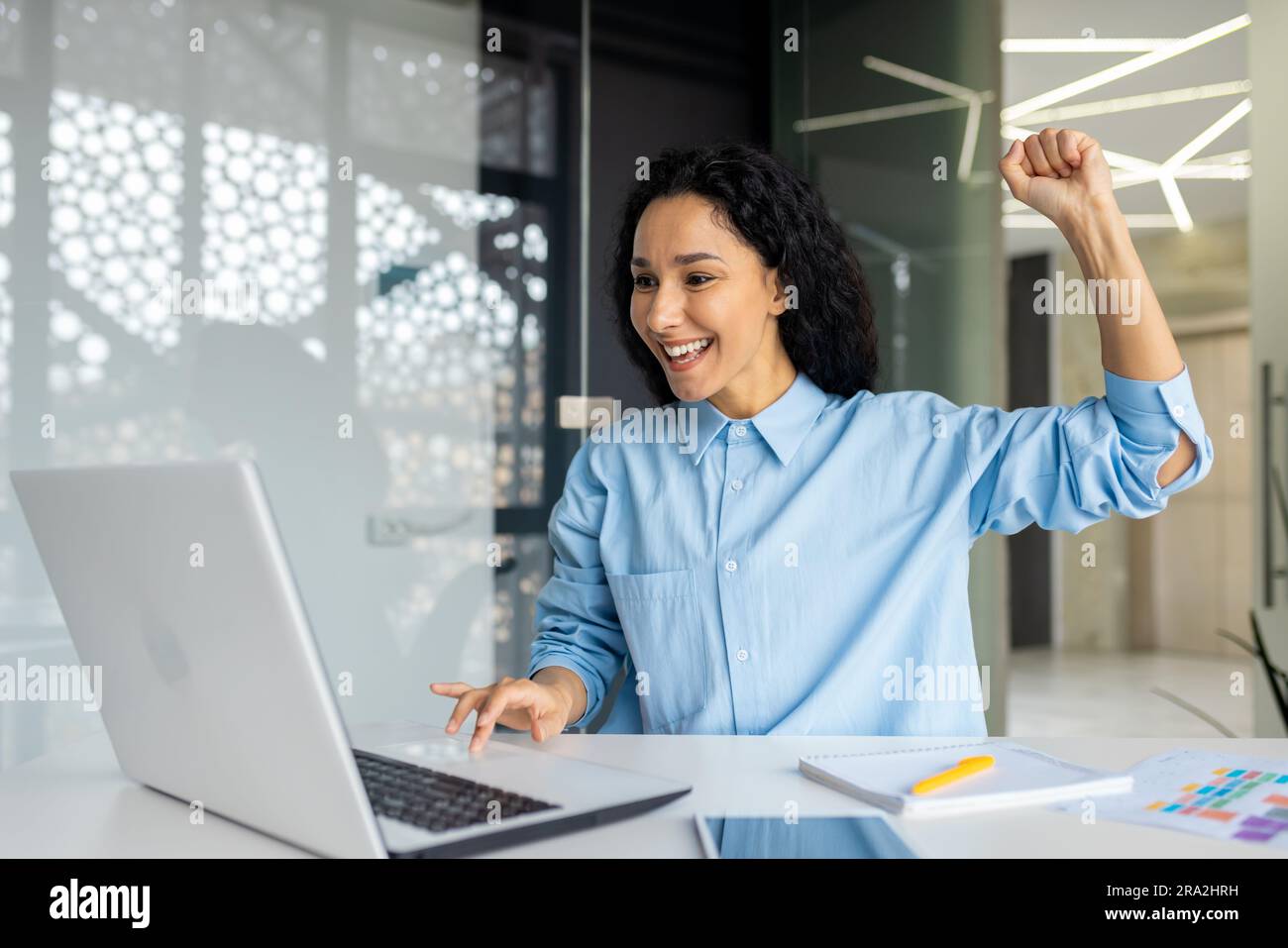 Joyful employee checking computer celebrating hi-res stock photography ...