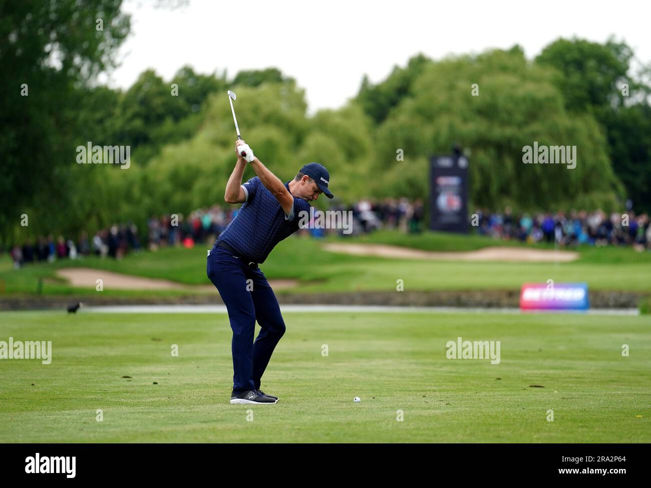 Justin Rose of England plays his second shot on the sixth hole during ...