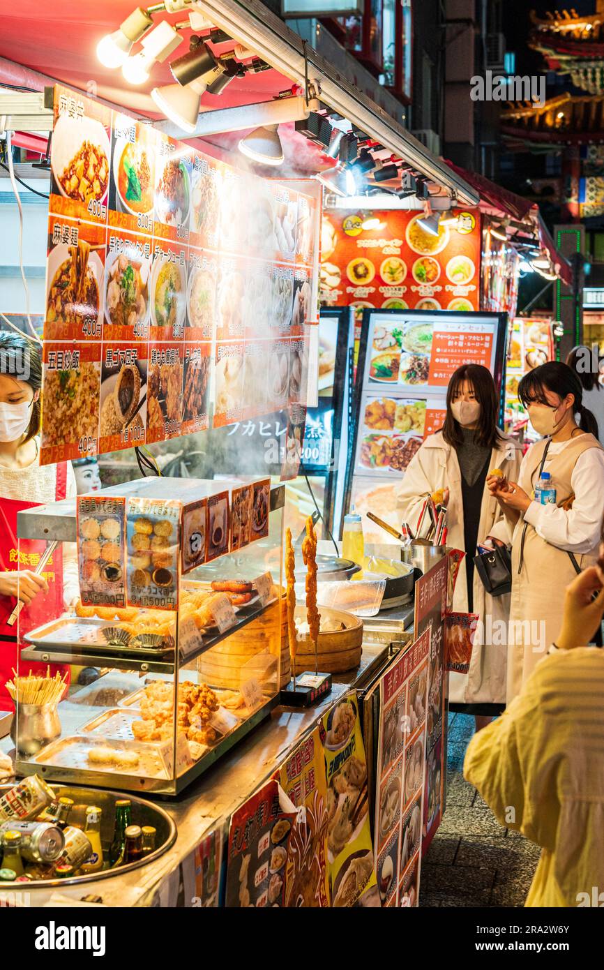 Popular busy Chinatown in Kobe, Japan. Chinese fast food stall selling ...