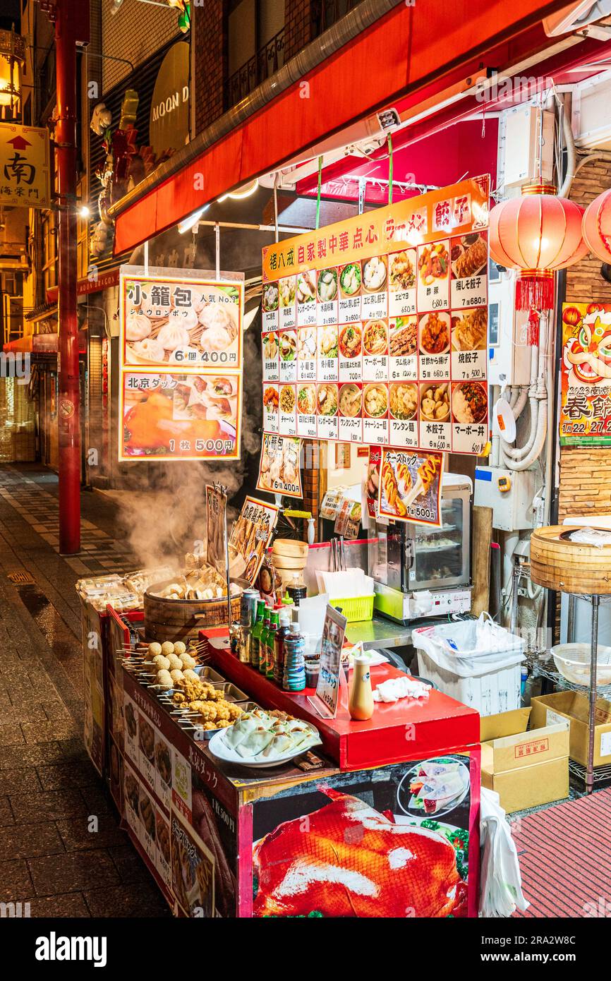 Empty Chinese food stall with steam rising from bamboo container of ...