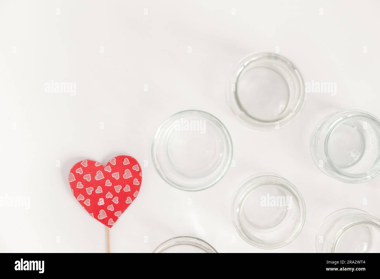 Assorted set of glass containers without lids on white background ...