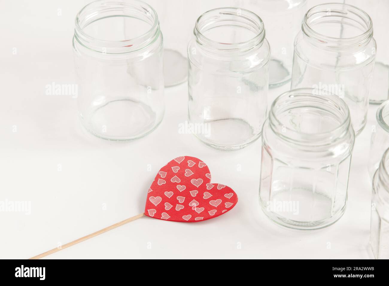 Assorted set of glass containers without lids on white background ...