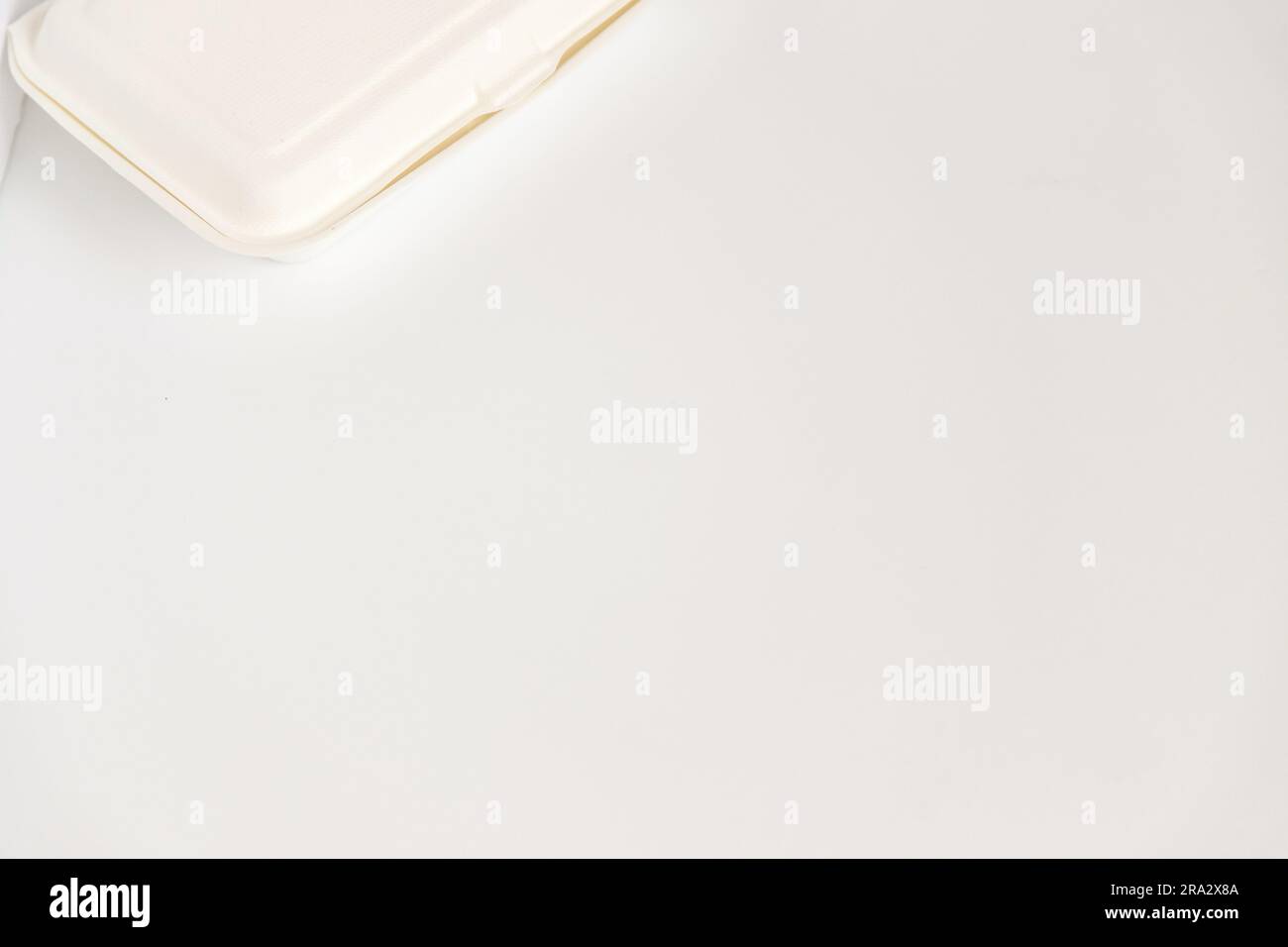 Detail of white card packaging on white background. Minimalist concept ...