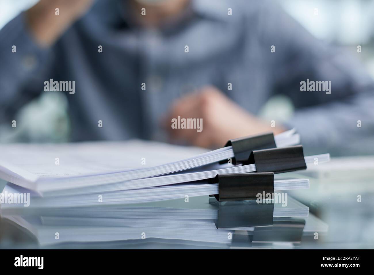Pile of unfinished documents on office desk, Stack of business paper ...