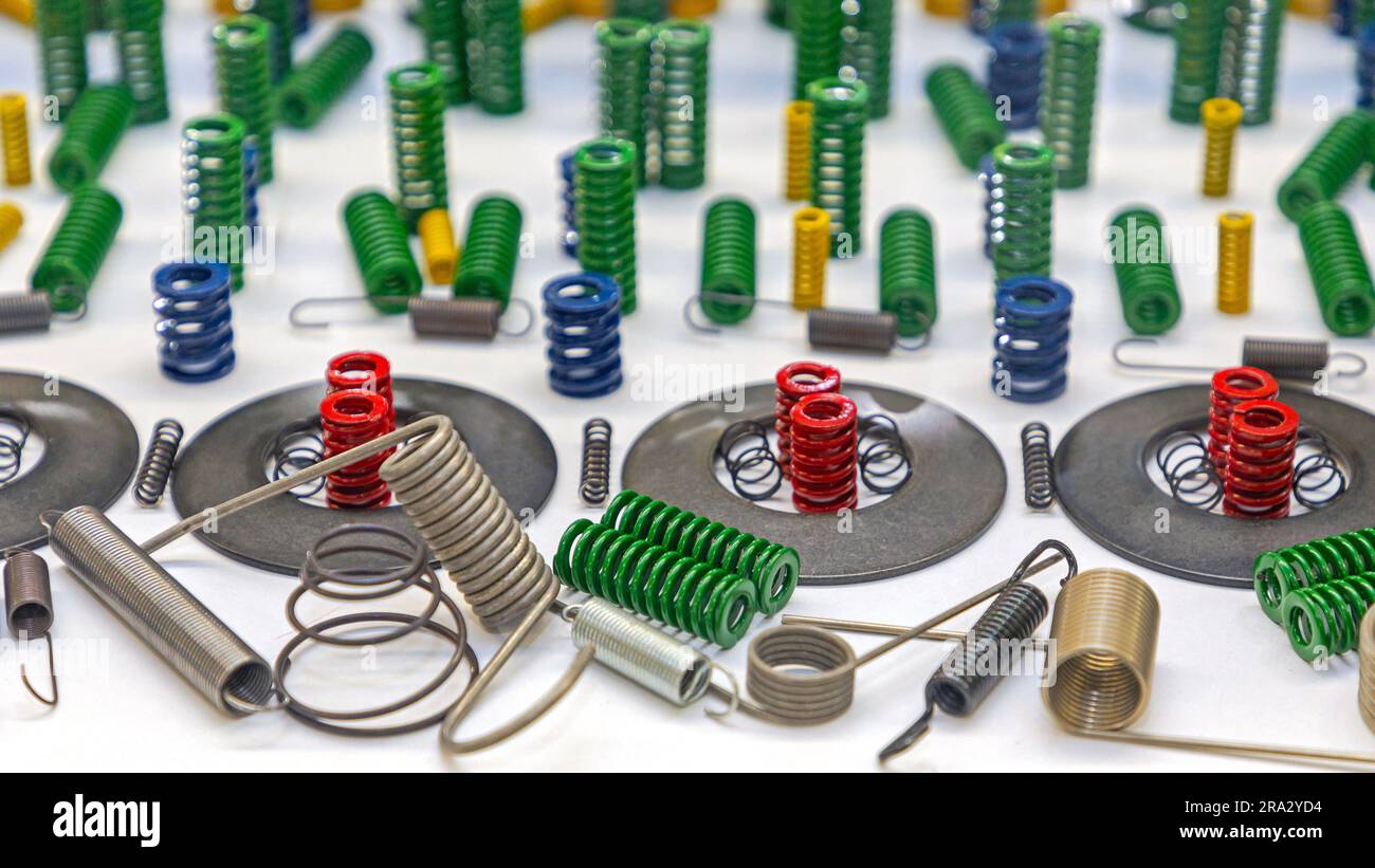 New Spring Coil Spare Parts for Industrial Machines Stock Photo - Alamy
