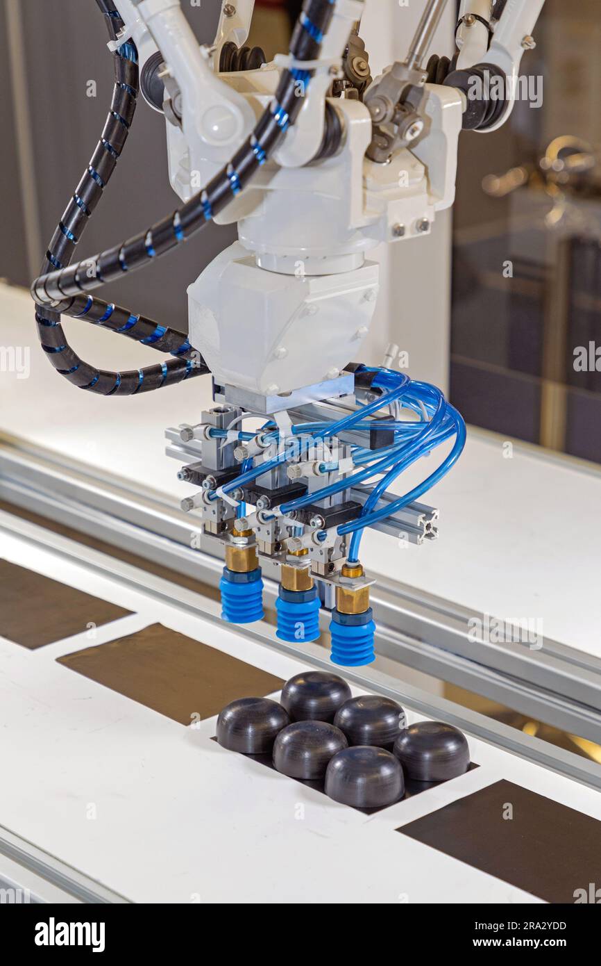 Vacuum suction robotic arm picking hi-res stock photography and images ...