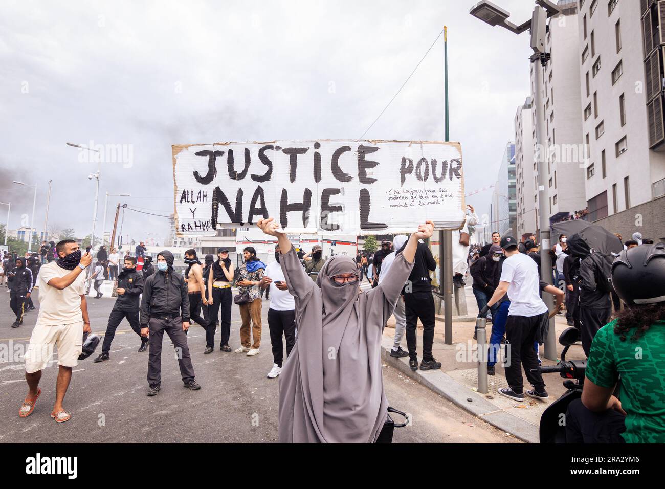 A protester holds a placard that says "Justice for Nahel" during the ...