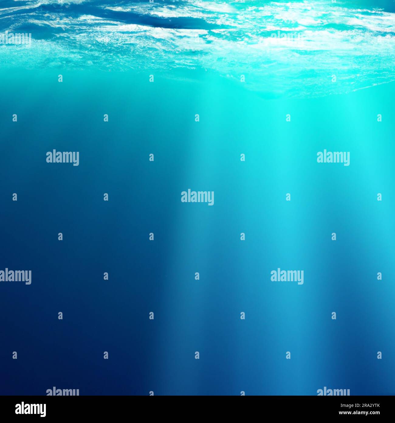 Beautiful blue ocean surface seen from underwater with rays of sunlight ...