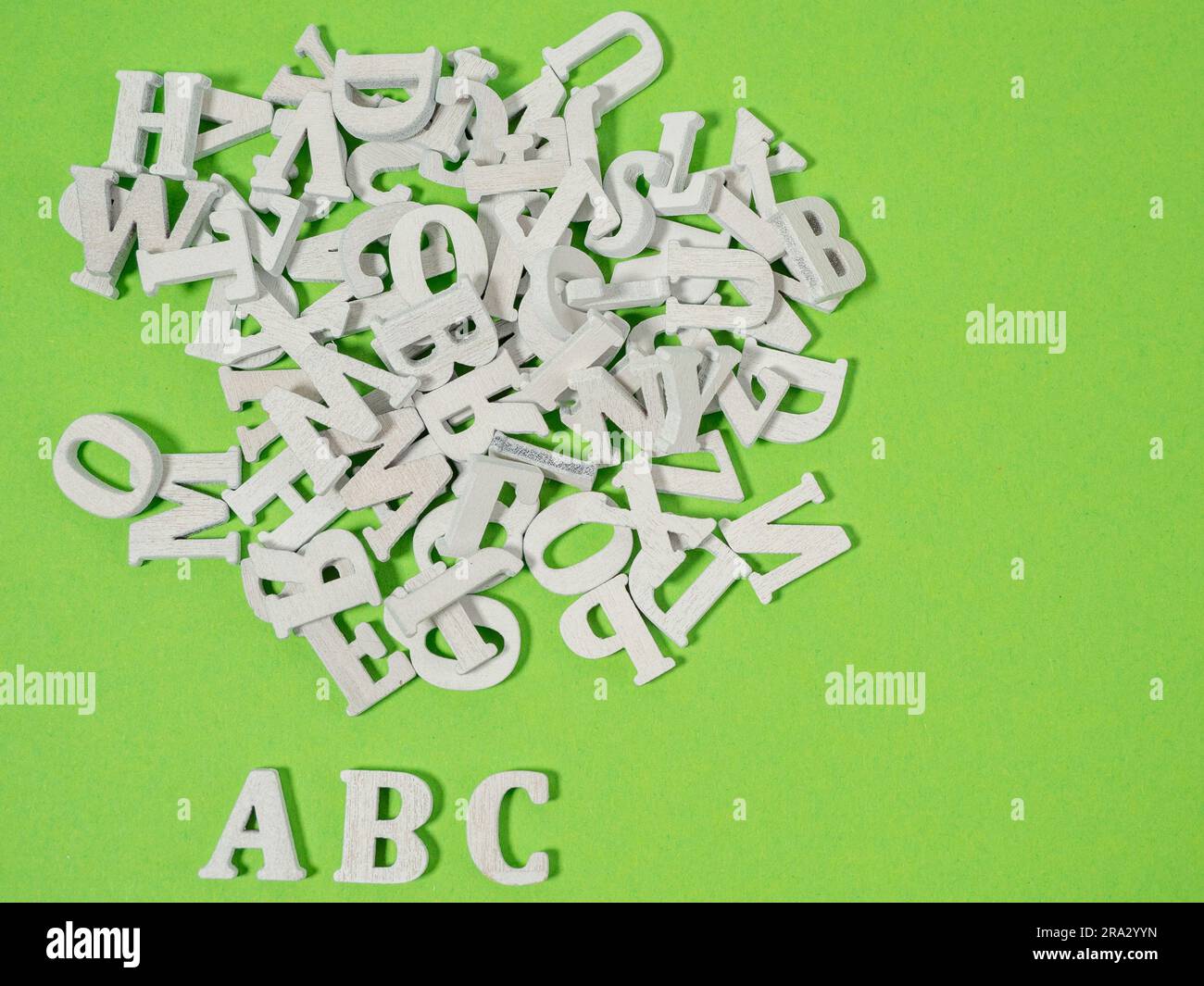 Wooden letters on a green background. Wooden letters abc concept of ...