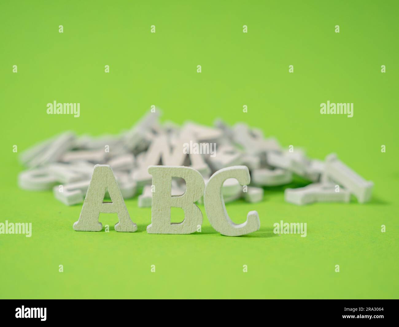 Wooden letters on a green background. Wooden letters abc concept of ...