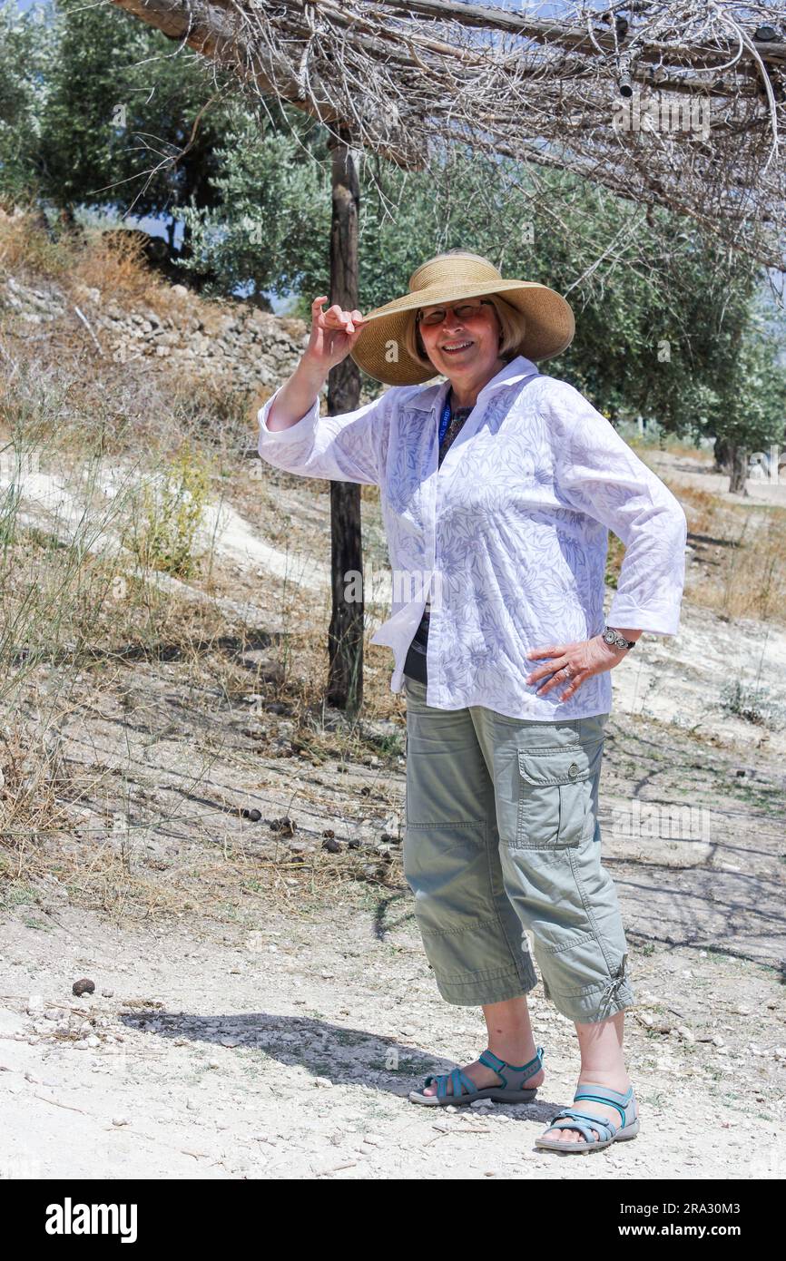 An American tourist tips her hat while visiting the Nazareth Village ...