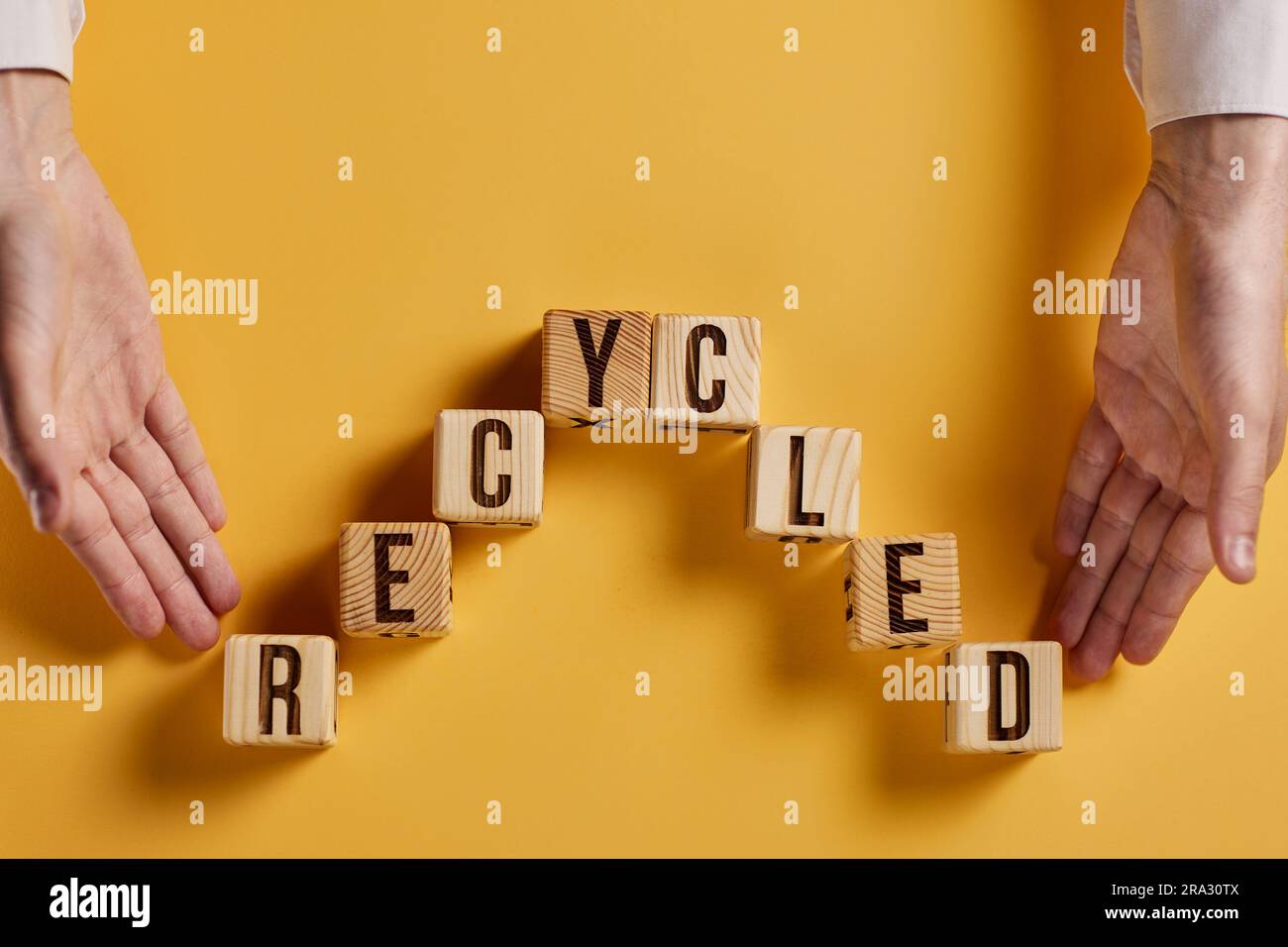 recycled word written on wood block. recycle text on cement table for ...