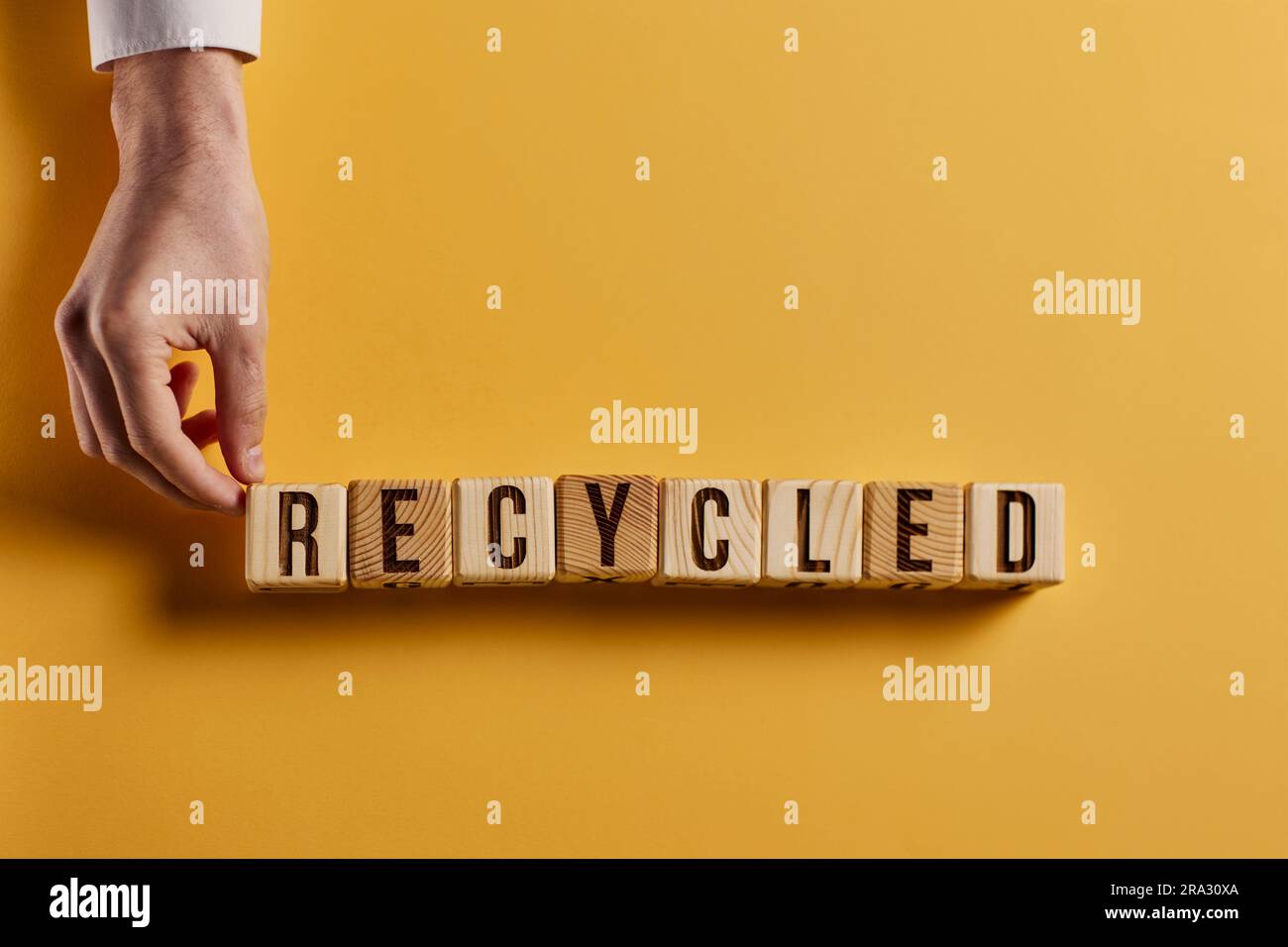 recycled word written on wood block. recycle text on cement table for ...