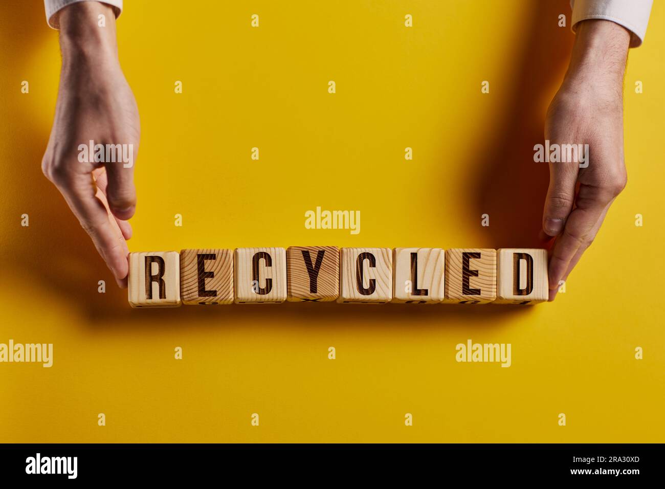 recycled word written on wood block. recycle text on cement table for ...