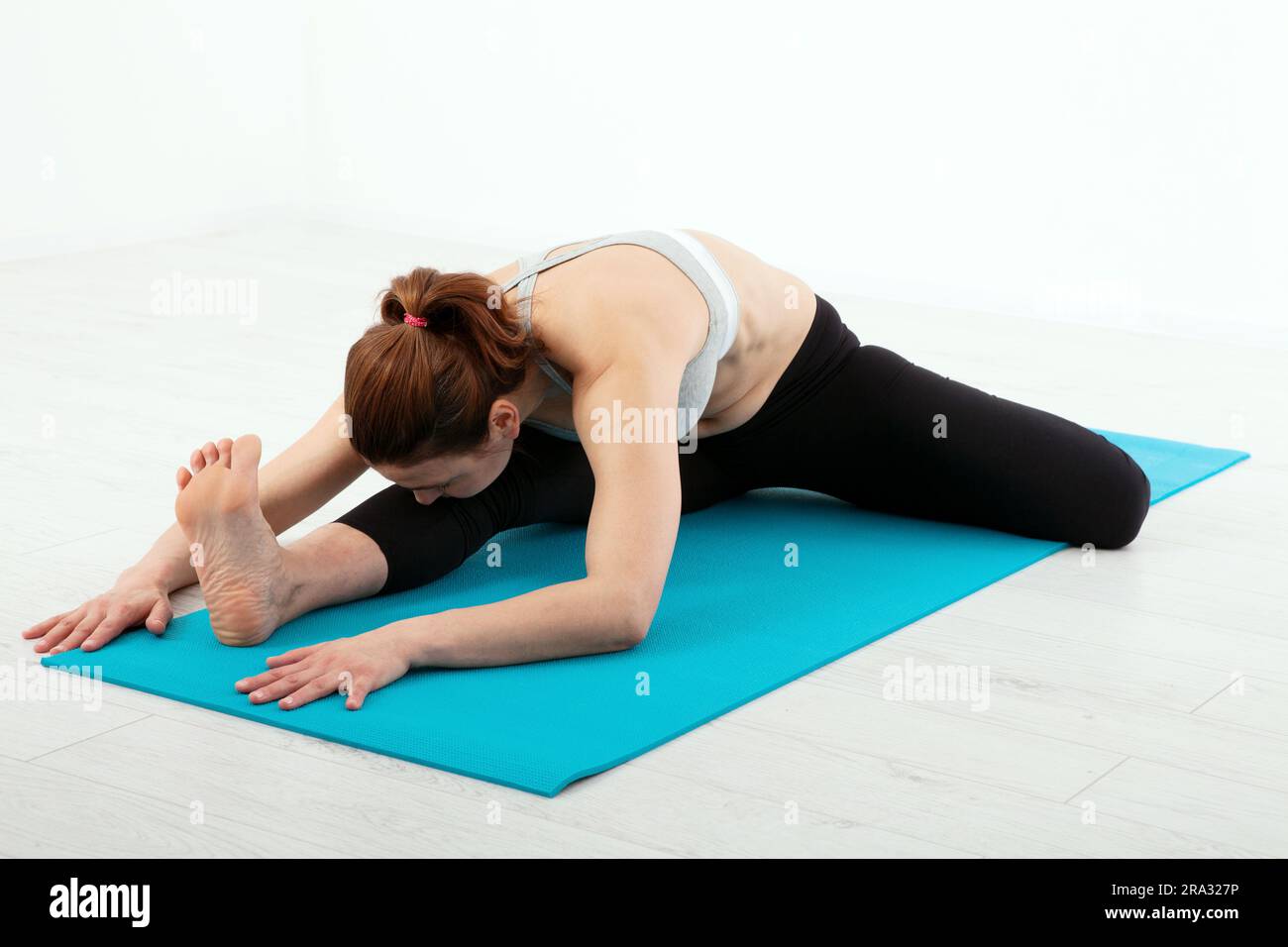 Feminine strength and elegance in yoga class. Breathtaking portrait of ...