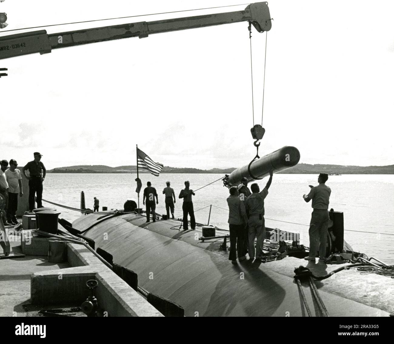 Photographs of Torpedos being Loaded onto the USS Pargo. This item ...