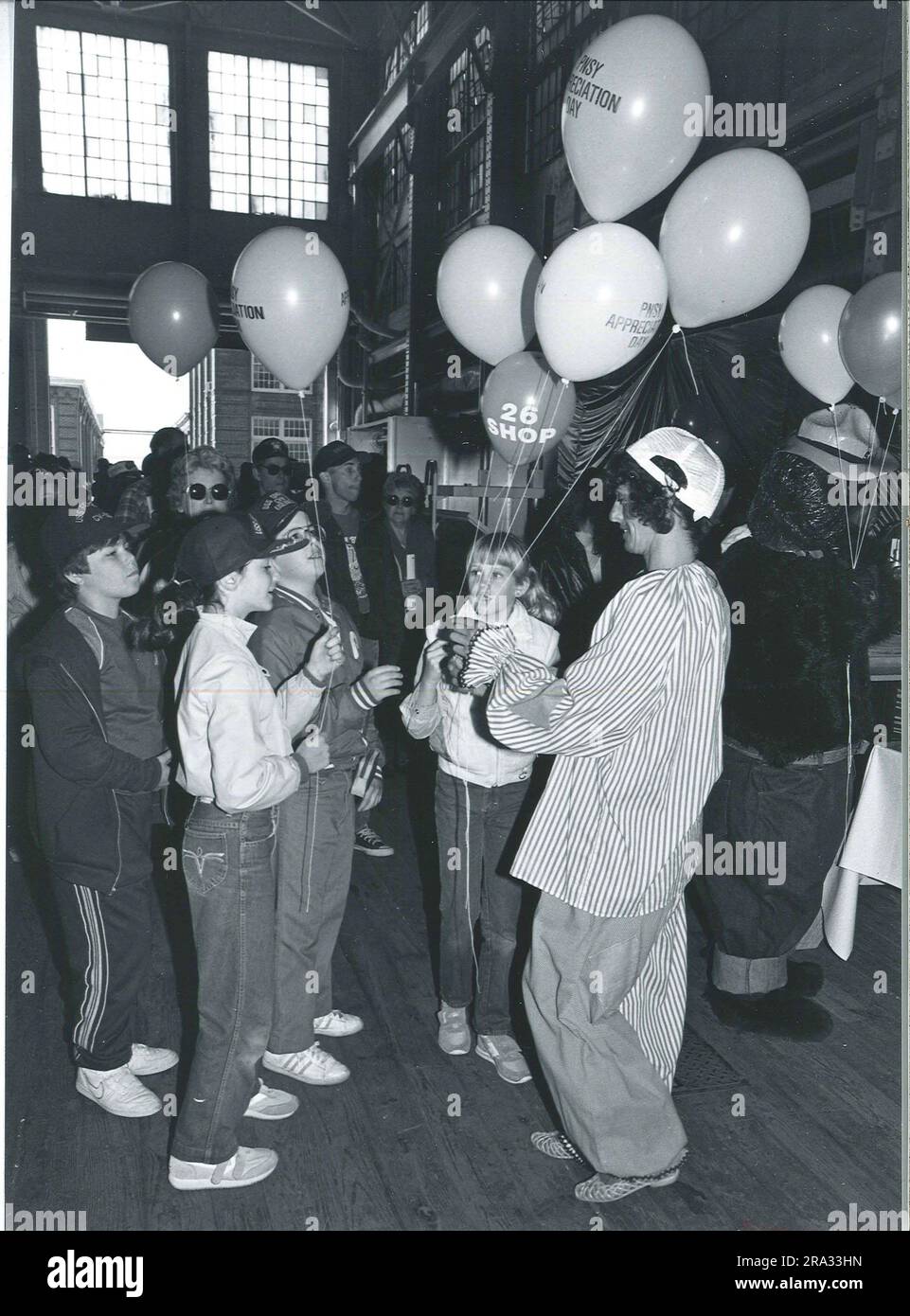 Man Handing Out Balloons on Employee Appreciation Day. This photograph ...