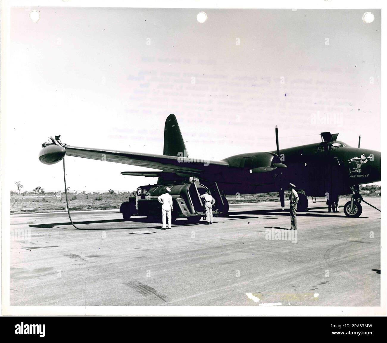 Photograph of Crew Filling an Auxiliary Fuel Tank on the Wing of The Truculent Turtle Before ...