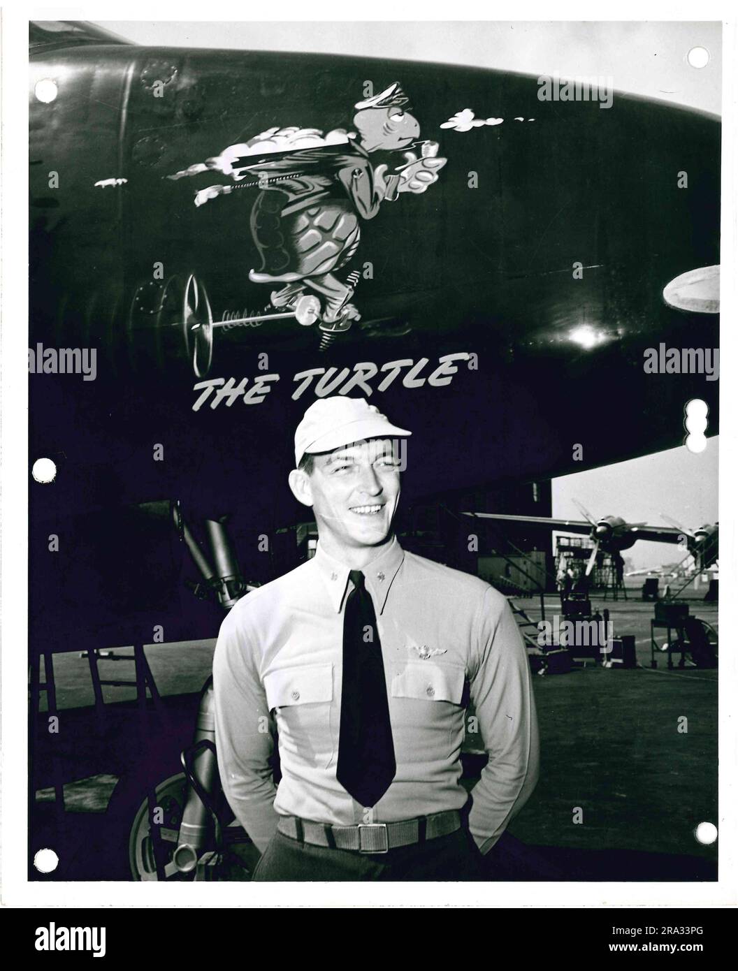 Photograph of Lt. Commander Roy H. Tabeling Standing at the Nose of The Truculent Turtle Stock ...