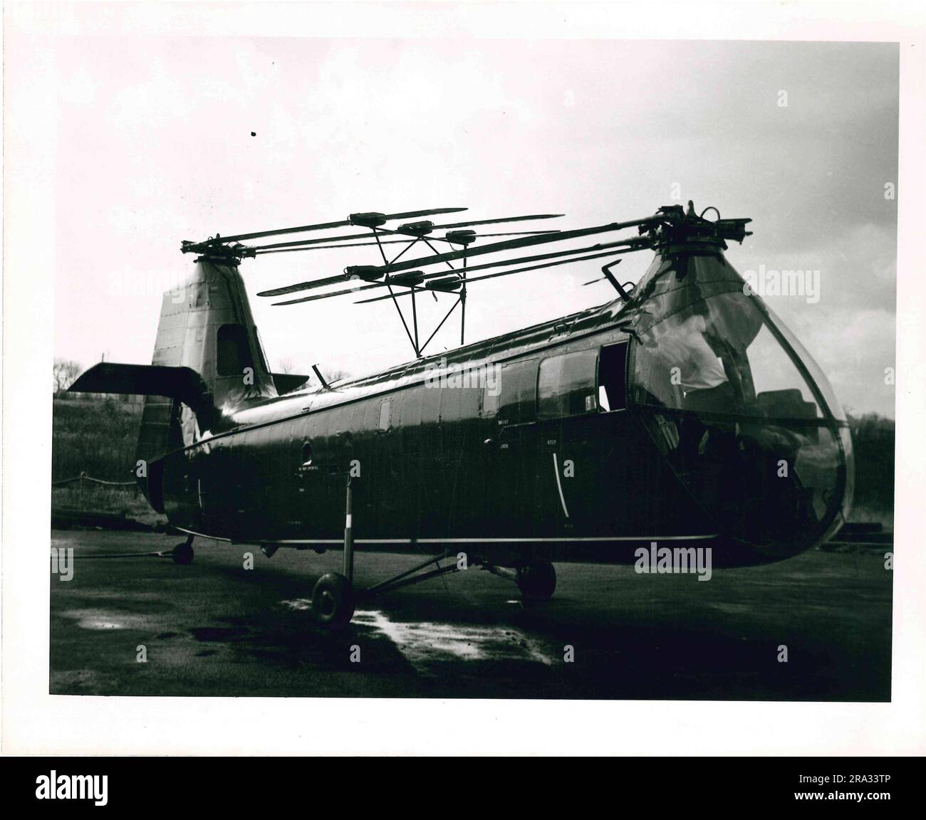 Photograph of Tandem Rotor Helicopter Grounded and Blades Folded Stock ...