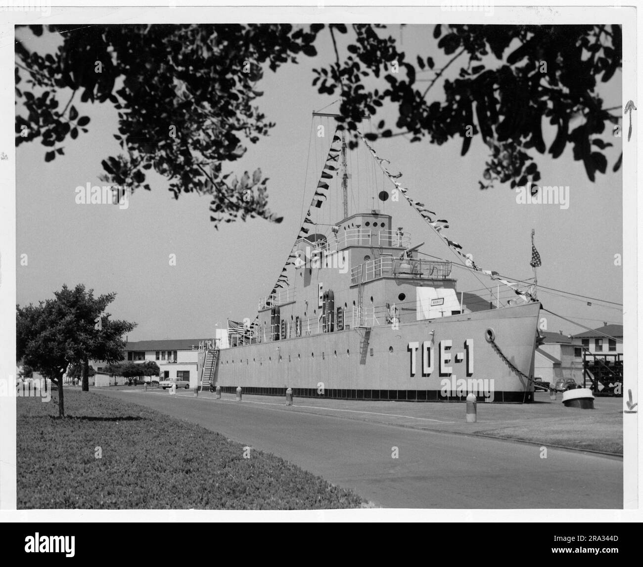 USS Recruit with Flags Tied to the Mast Stock Photo - Alamy