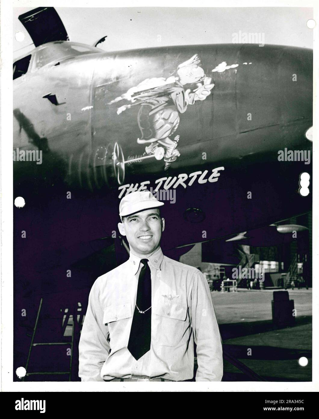 Photograph of Commander Eugene. P. Rankin Standing at the Nose of The ...