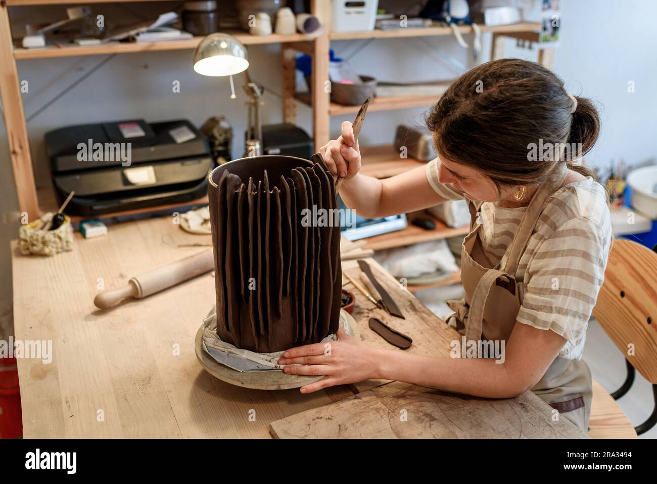 Woman potter scraping vase raw hi-res stock photography and images - Alamy