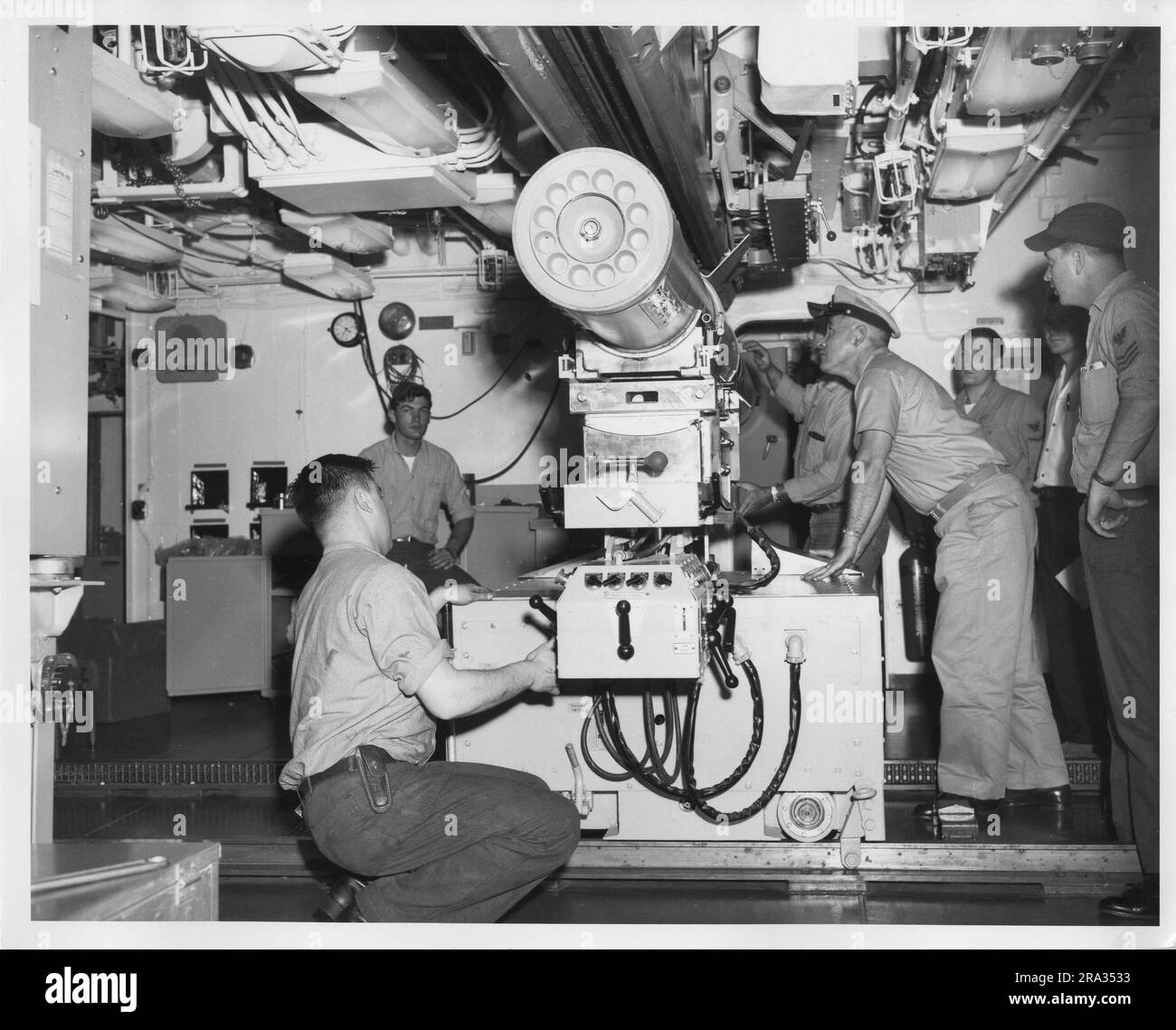 Seven Employees Inspecting Torpedo Machinery Aboard USS Sterett. This ...