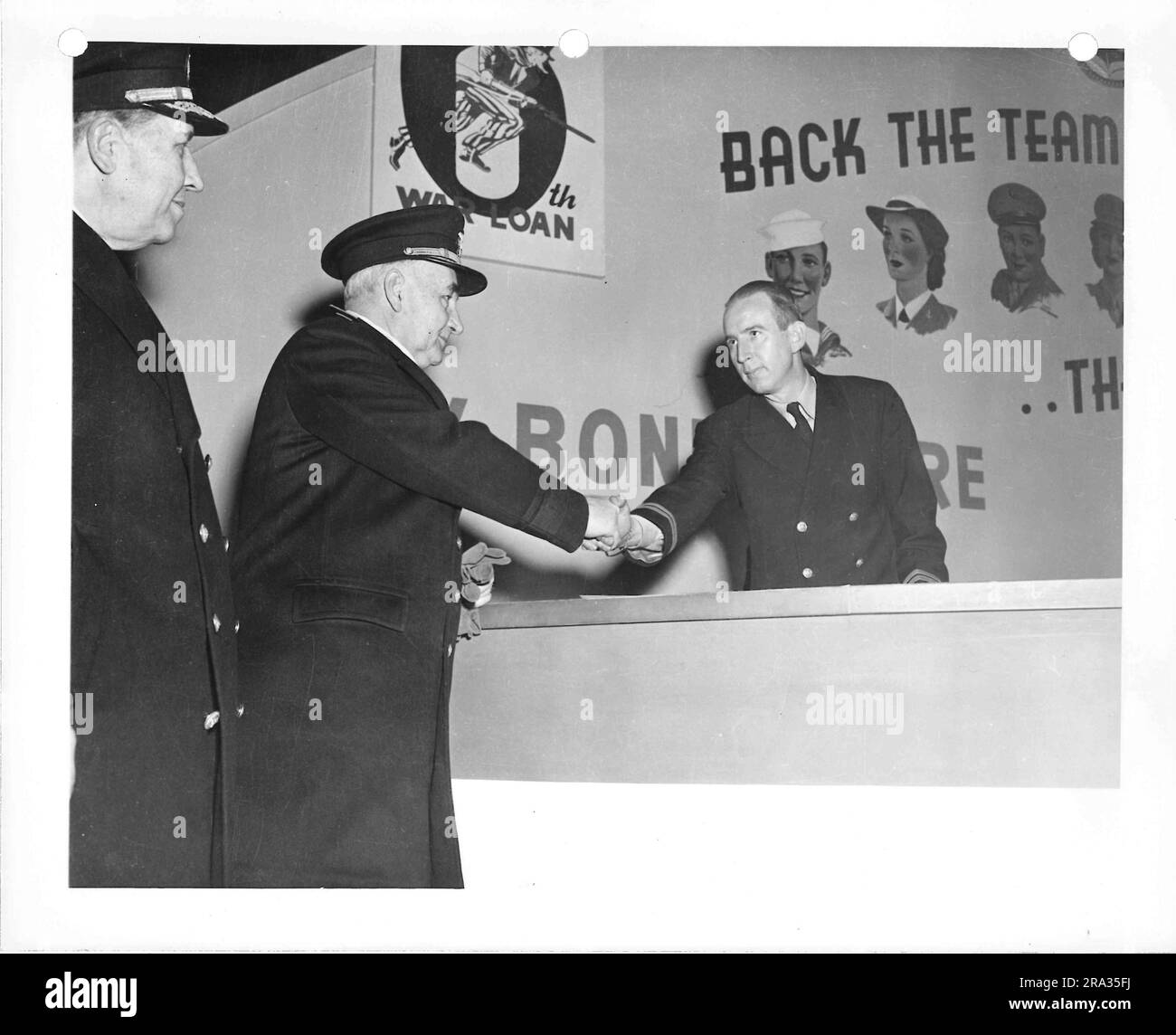 Photograph of Two Men in Military Uniform Shaking Hands in Front of ...