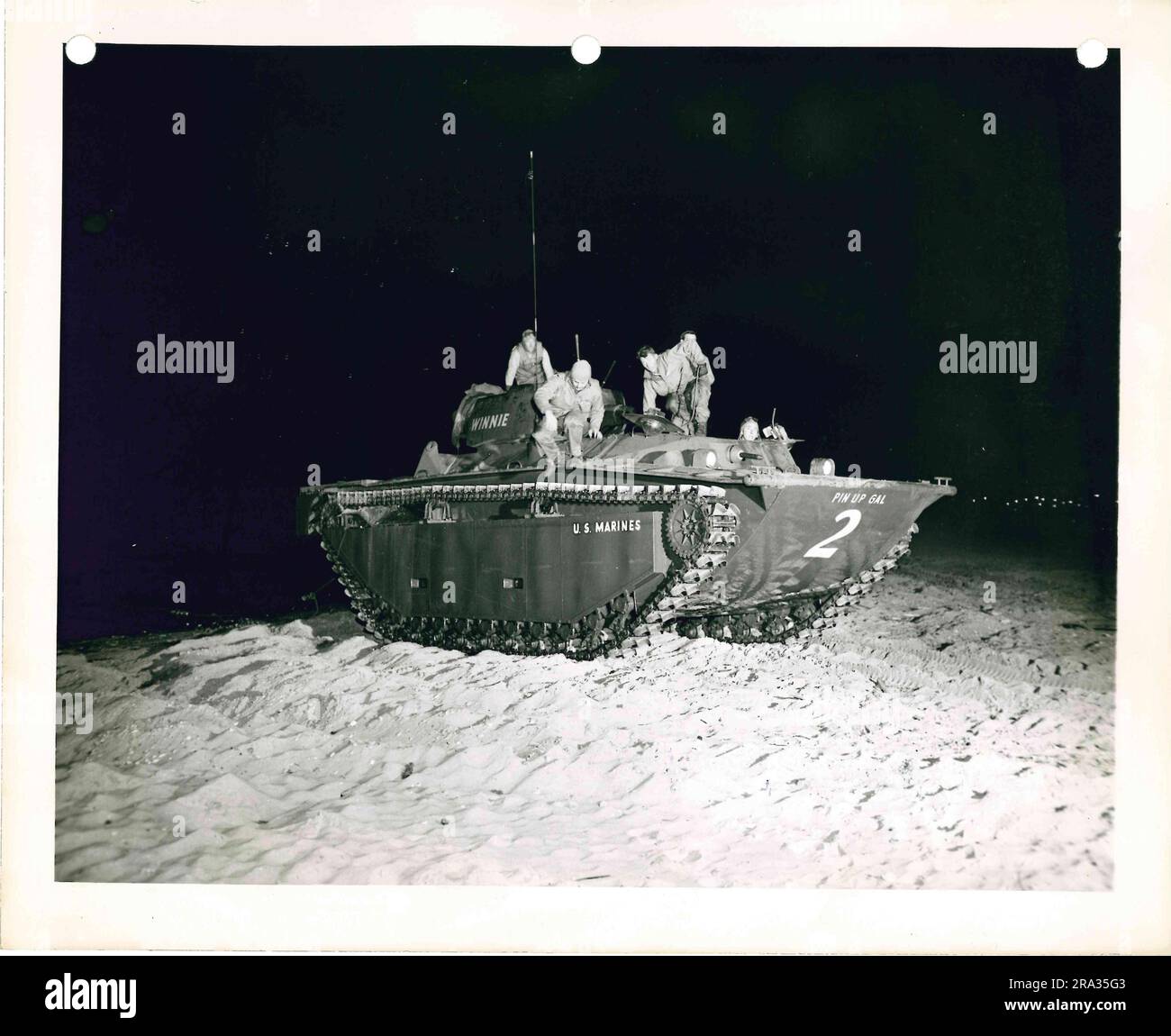Photograph of Military Individuals in Tank with Words "U.S. Marines ...