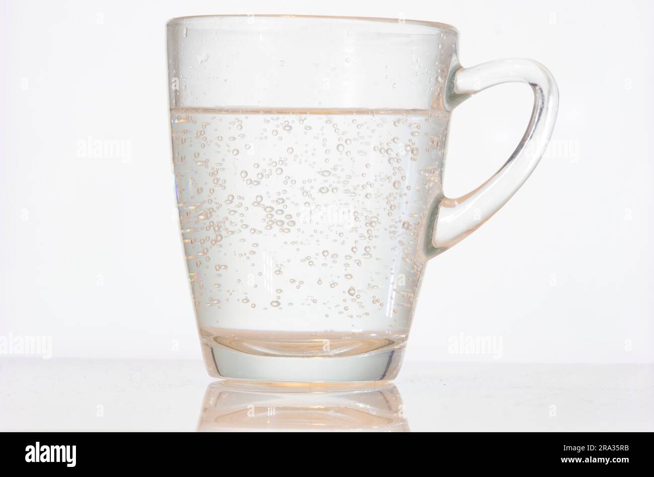 A glass of sparking mineral water against a white background Stock ...