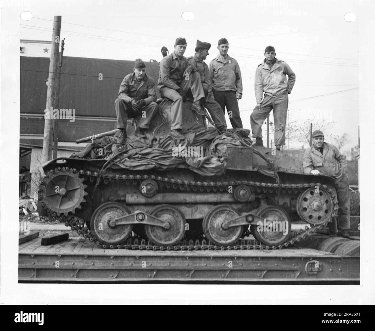 Photograph of Men on Tank Stock Photo - Alamy