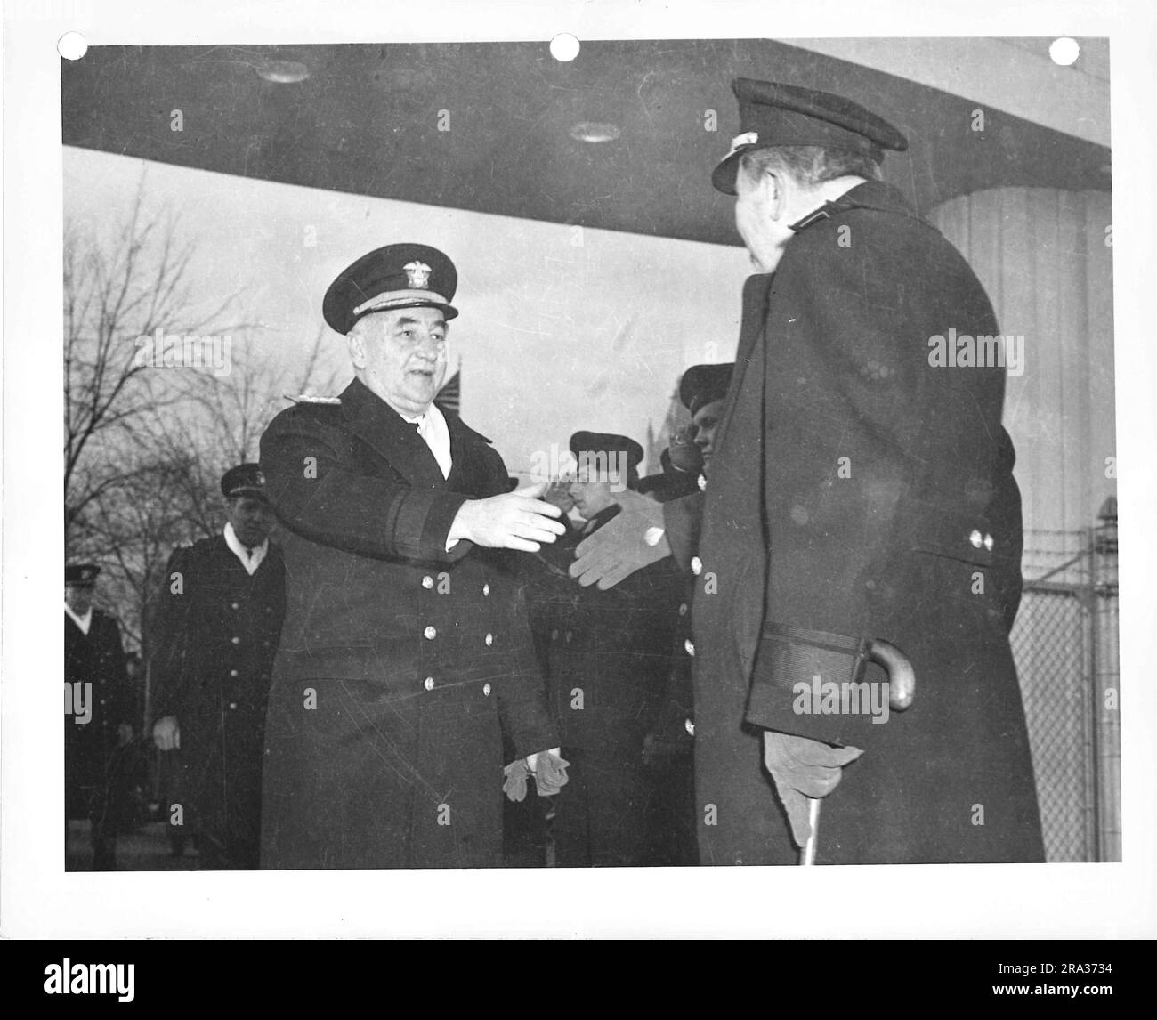 Photograph of Two Men in Military Uniform Shaking Hands Stock Photo - Alamy