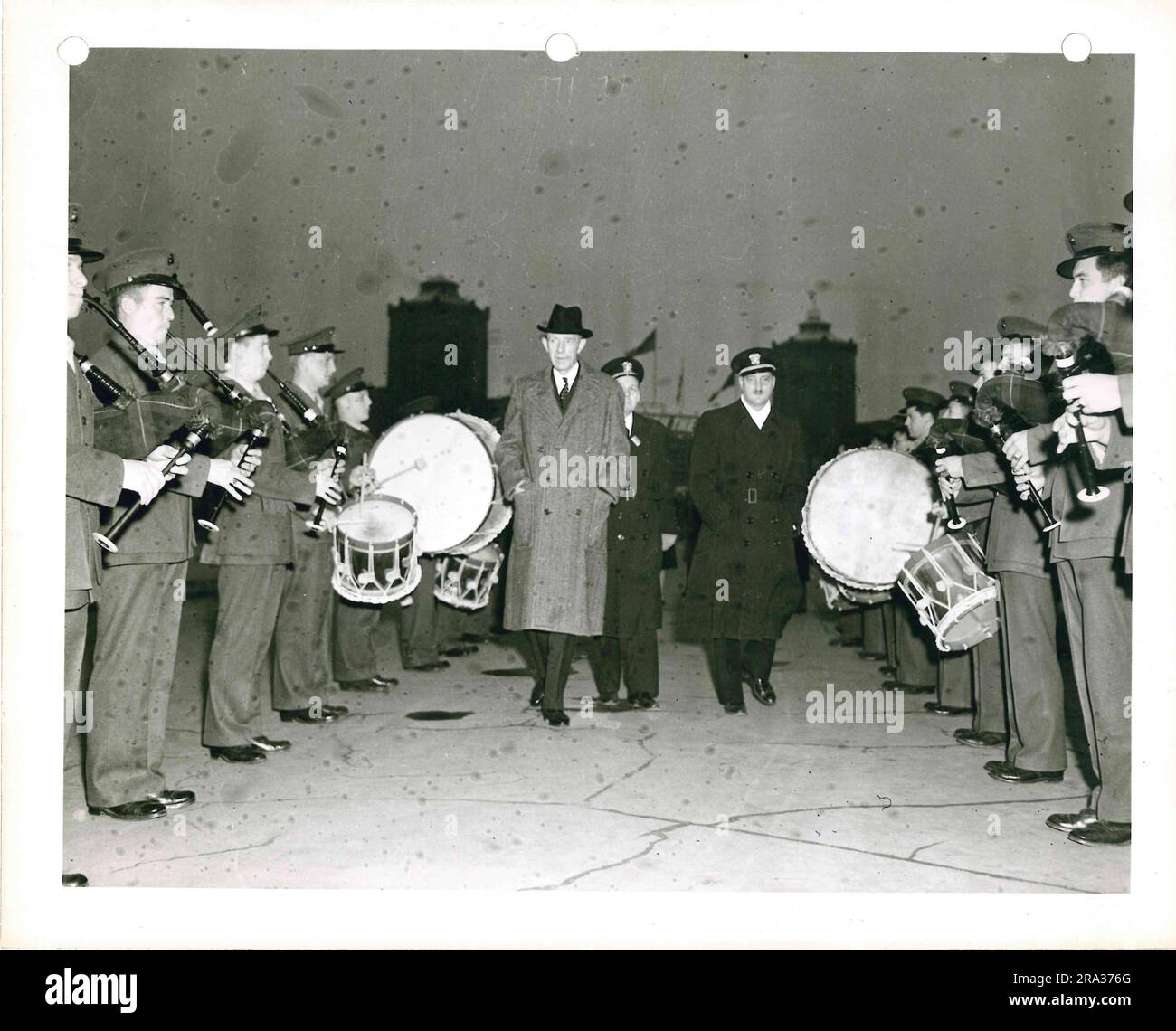 Photograph of Three Men (Two in Military Uniform) Walking in a ...