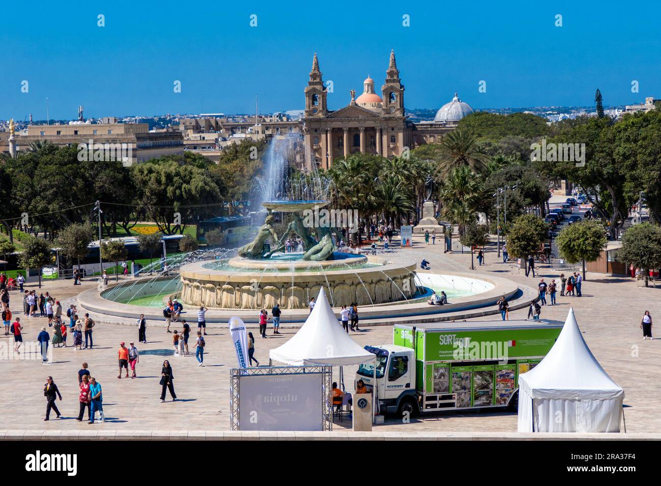 Valletta, Malta, 5 May 2023. Triton Fountain of Valletta and St Publius Church of Floriana ...