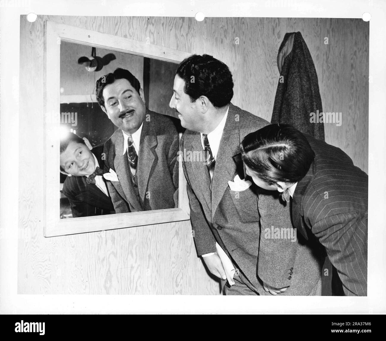 Photograph of Man and Boy Looking into Mirror Stock Photo - Alamy