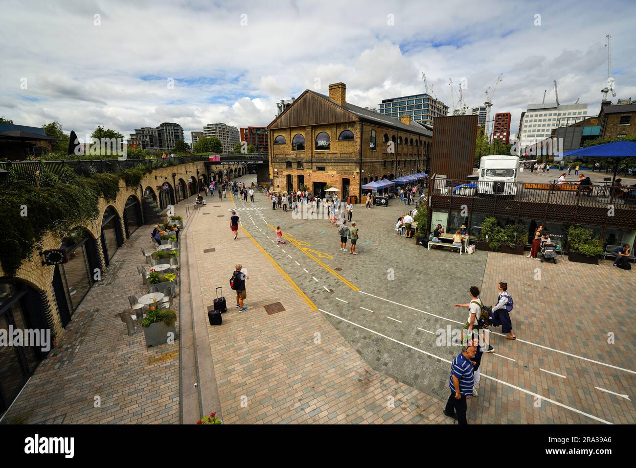 Coal Drops Yard in London is a redeveloped coal yard, now an outdoor mall, market with shops ...
