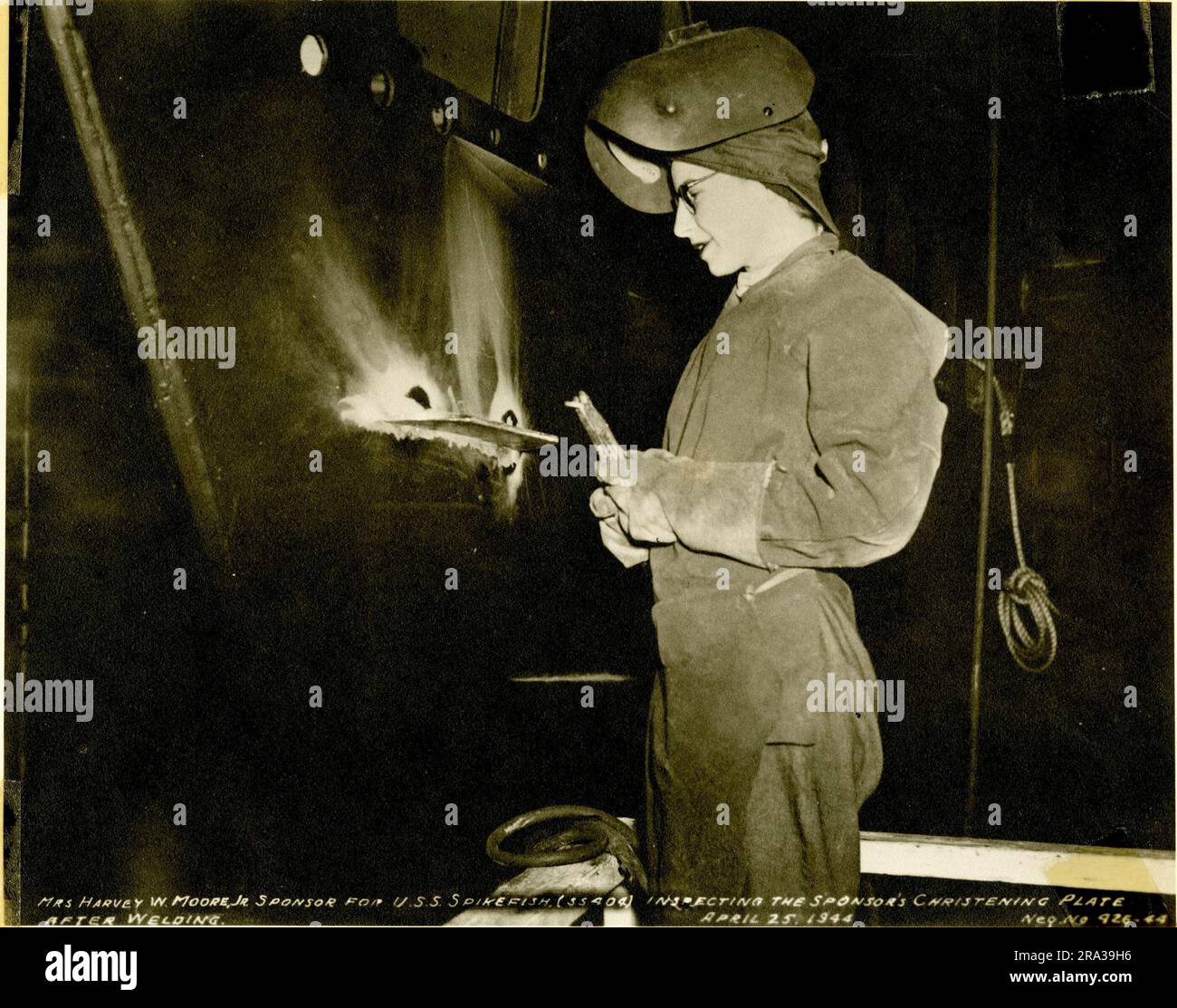 Mrs. Harvey W. Moore, Jr., Inspects the Sponsor's Christening Plate ...