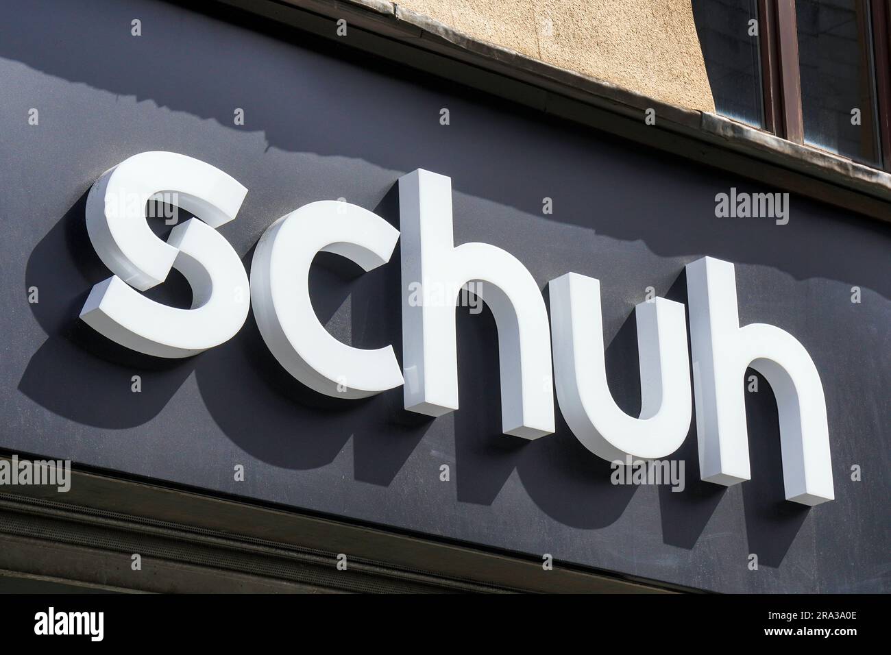 schuh. retailer for fashion footwear, shoes and trainers, sign and ...
