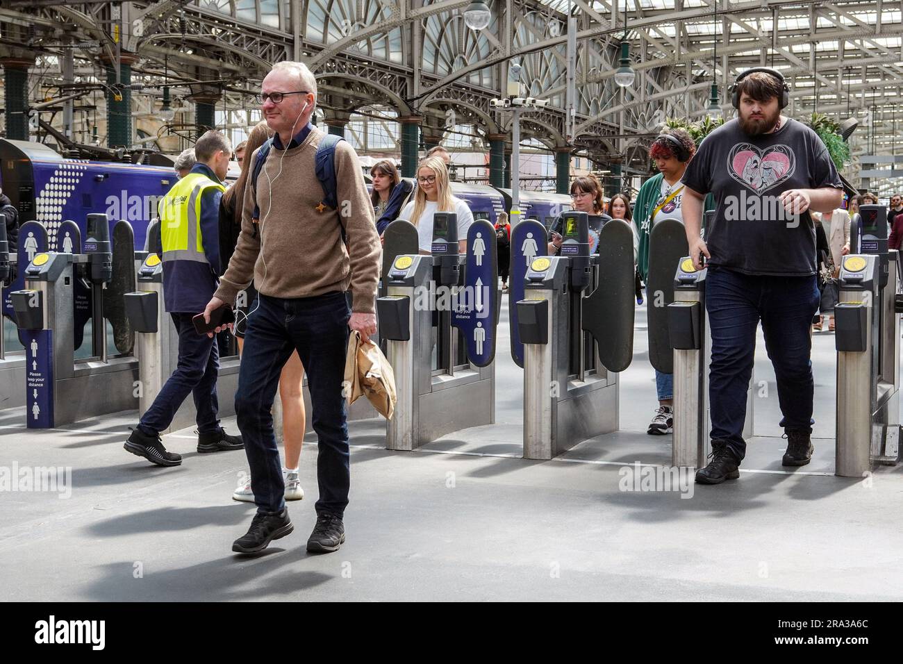 Passengers leaving a Scotrail train and walking on the platform ...