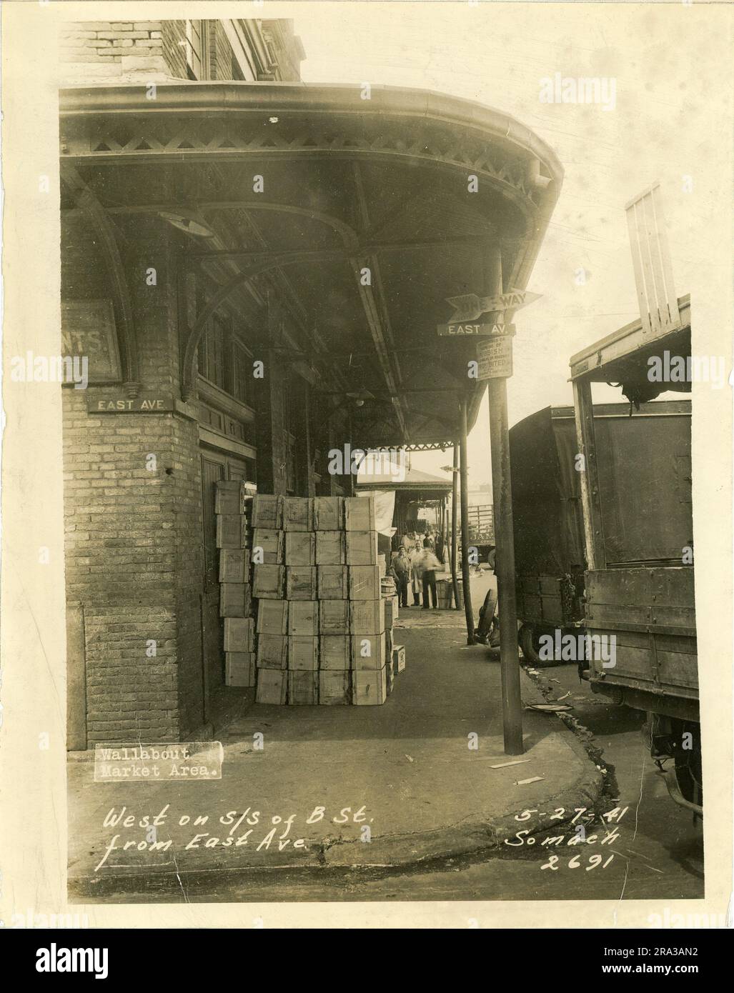 Photograph of sidewalk outside market buildings looking west on south ...