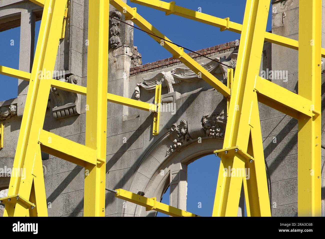 Large yellow scaffolding during total renovation of an old building ...