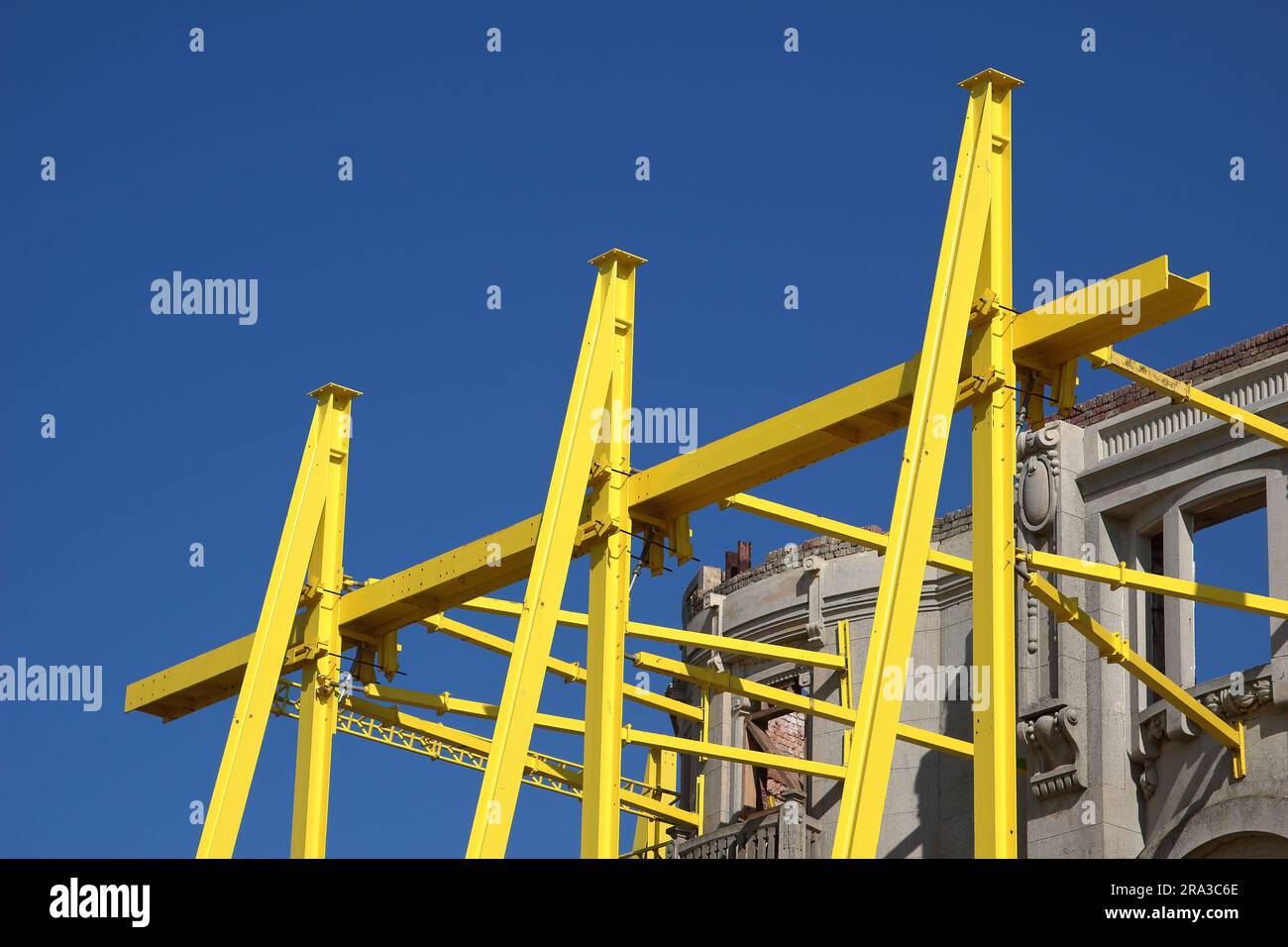Large yellow scaffolding during total renovation of an old building ...