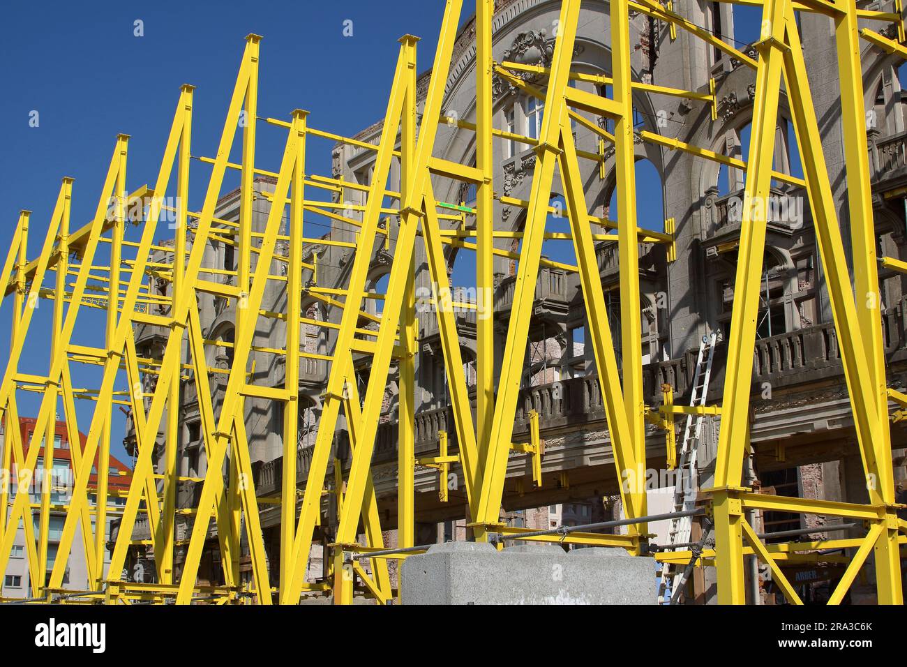Large yellow scaffolding during total renovation of an old building ...