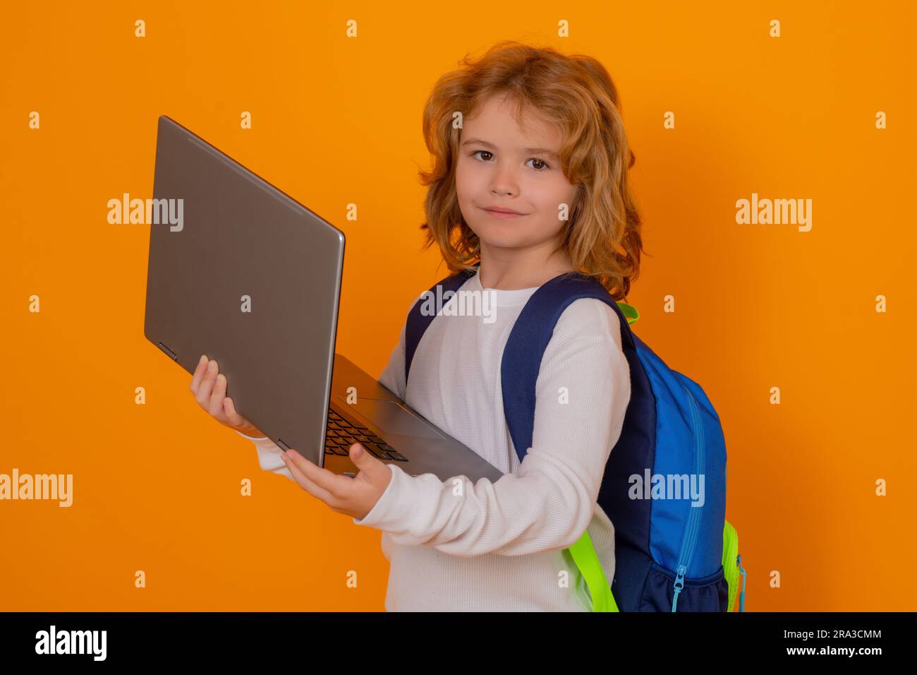 School kids. School child using laptop computer. School kid 7-8 years ...