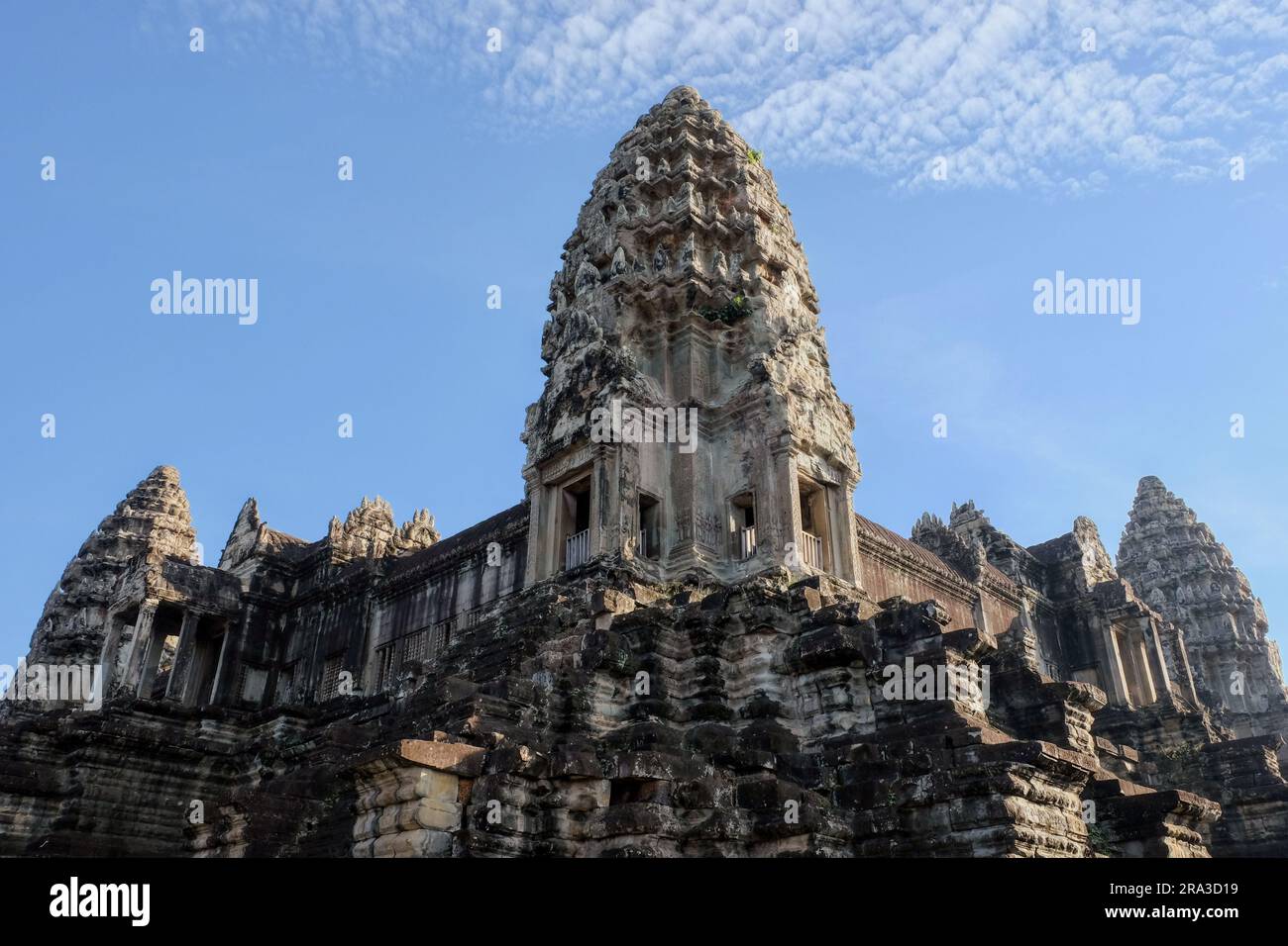 The tall decorated stone tower of the Khmer temple of Angkor Wat in ...