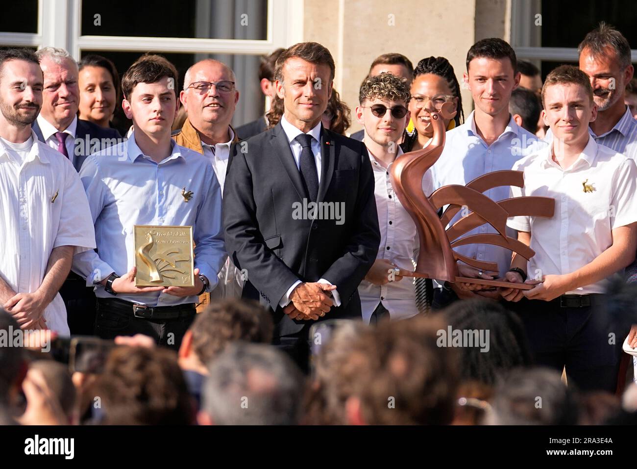 French President poses with the "Worldskills" laureates as he ...