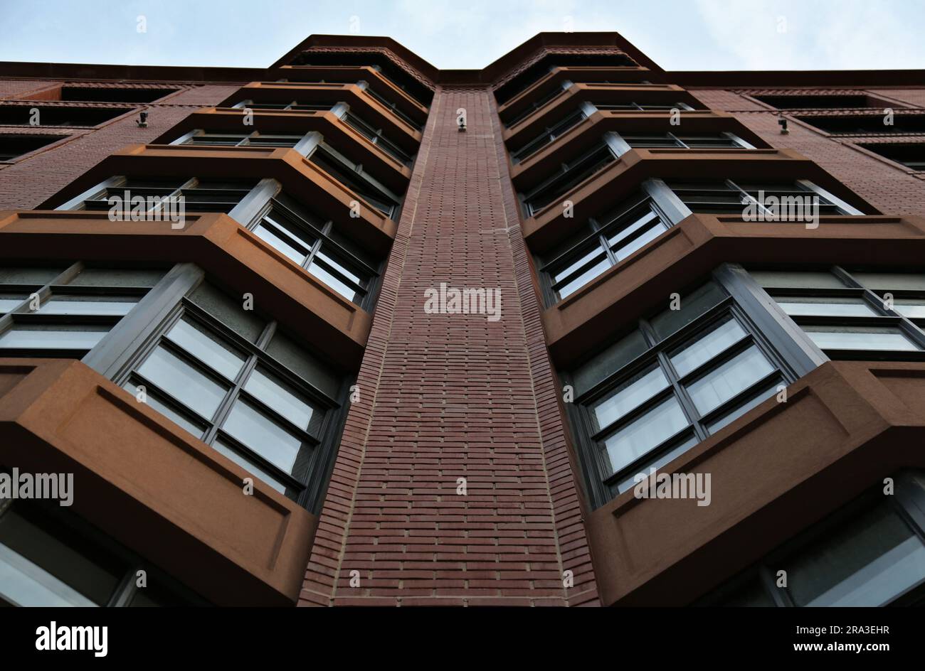 tall building facade (view looking up) modern apartment housing and ...